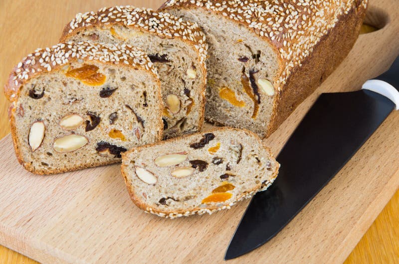 Cut Bread with Fruit and Nuts Stock Photo - Image of cross, baked: 40325512