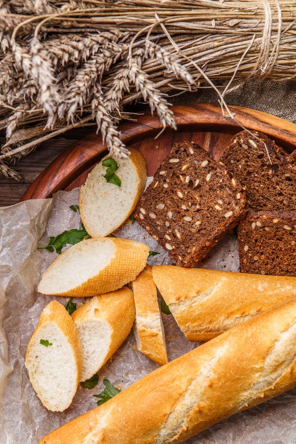 Cut bread in wooden dish stock photo. Image of coarse - 85971042