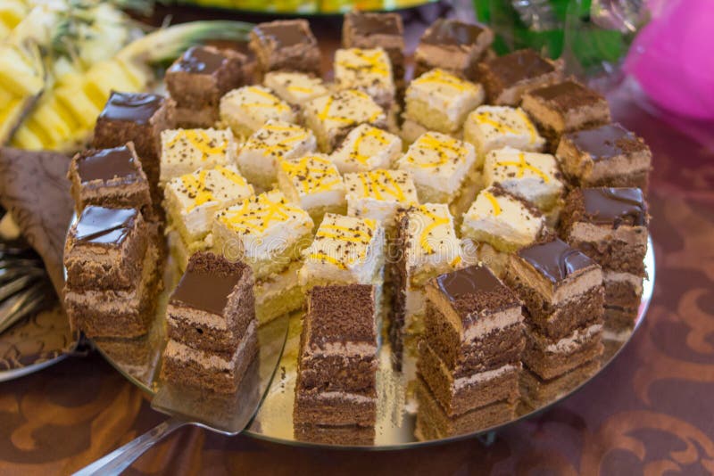 Cut Cake in a Restaurant,on a Buffet Table Cut Pieces of Cake Stock ...