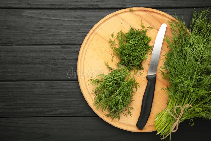 Cut Dill on Cutting Board on Black Background Stock Image - Image of ...
