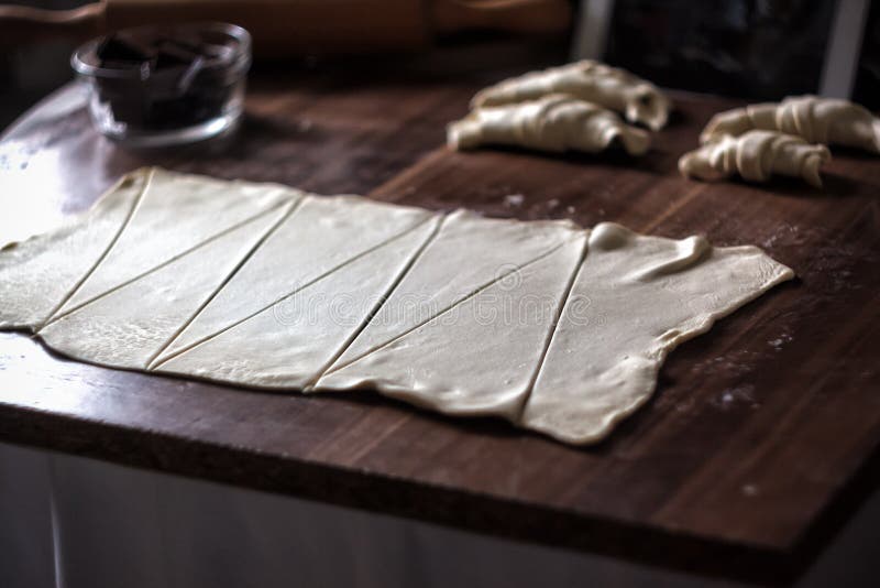 Cut the Dough into Triangles for Croissants with Chocolate Stock Photo ...