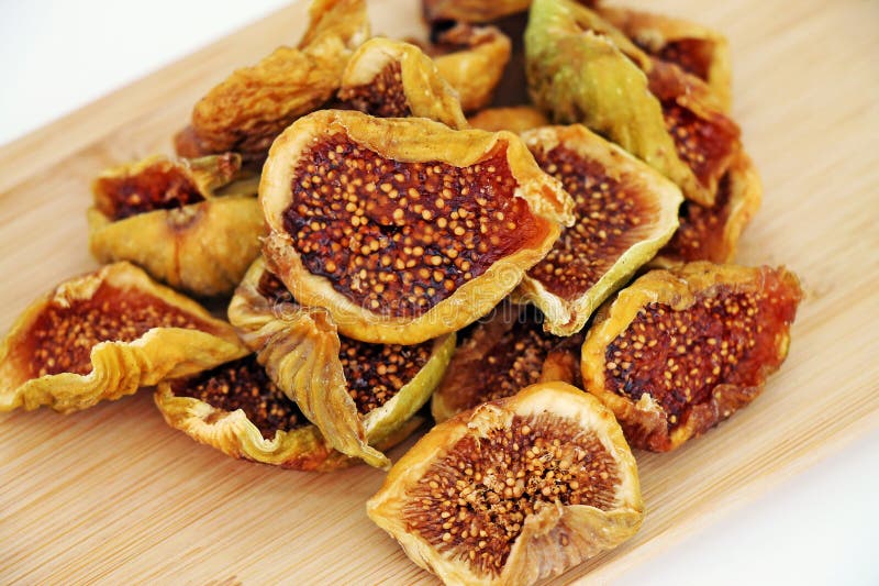 Cut Dried Figs on Wooden Background Close-up. Stock Image - Image of ...