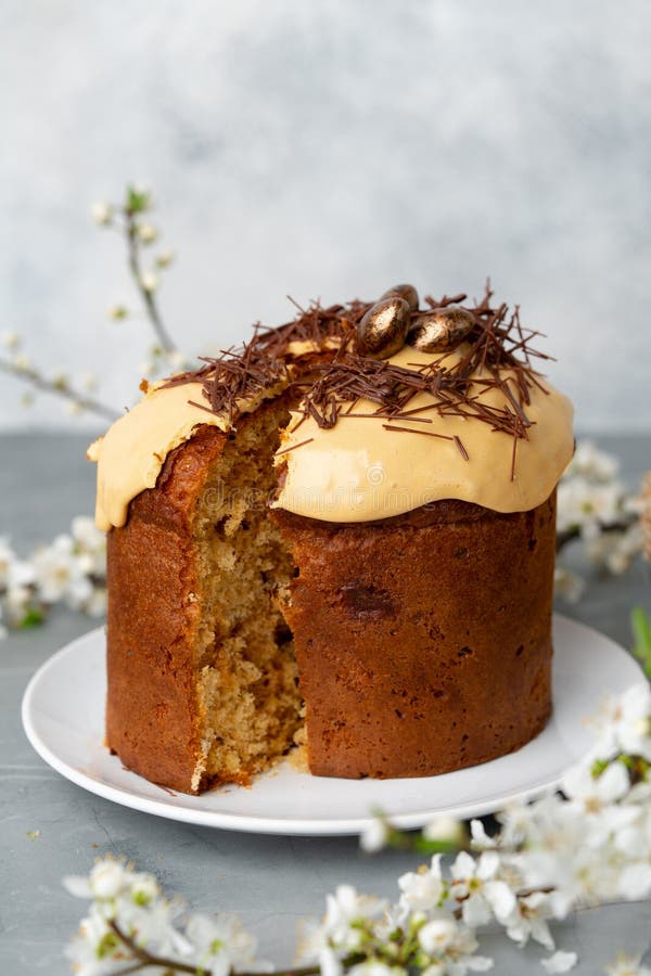 Cut Easter Cake on Plate Decorated with Spring Flower Branches Stock ...