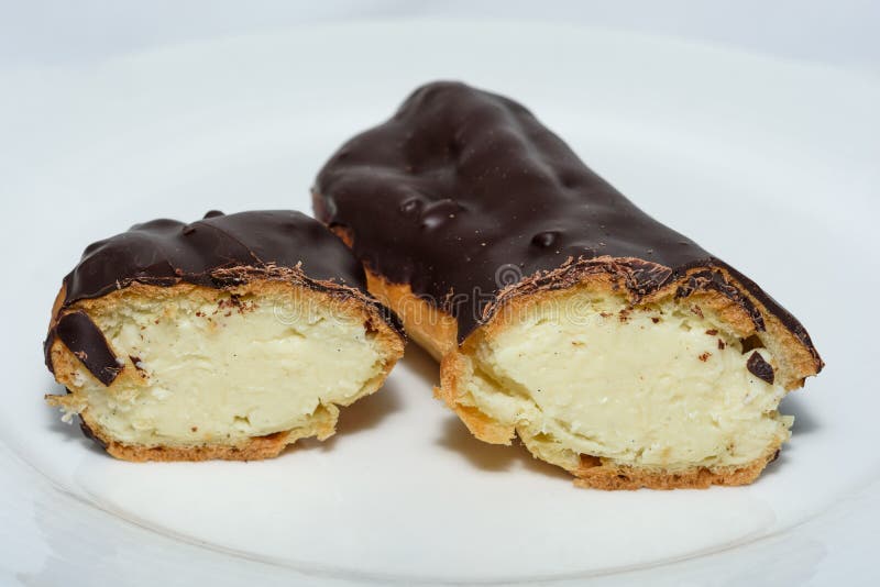 Cut Eclair on White Background Stock Photo - Image of pastry, close ...