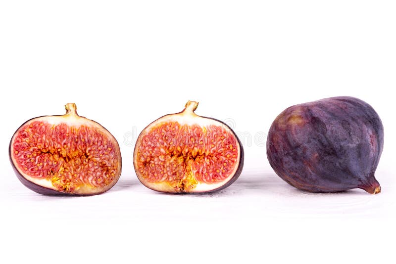 Cut Figs on White Wooden Surface Front View Stock Image - Image of ...