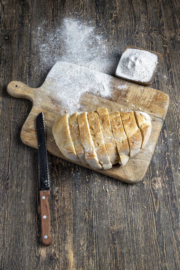 Cut Fresh Bread into Pieces while Cooking with Bread Stock Image ...