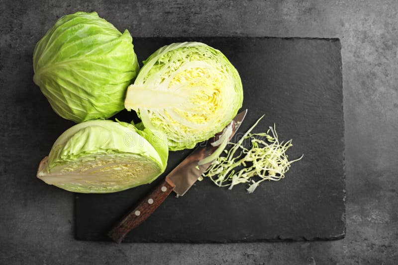 Cut Fresh Cabbage with Knife on Slate Plate Stock Photo - Image of ...
