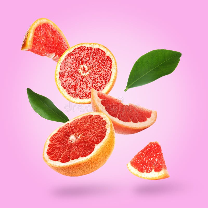 Cut Fresh Grapefruit and Green Leaves Flying on Light Magenta ...