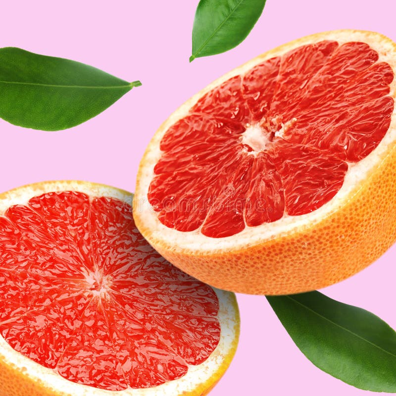 Cut Fresh Grapefruit and Green Leaves Flying on Pale Violet Background ...
