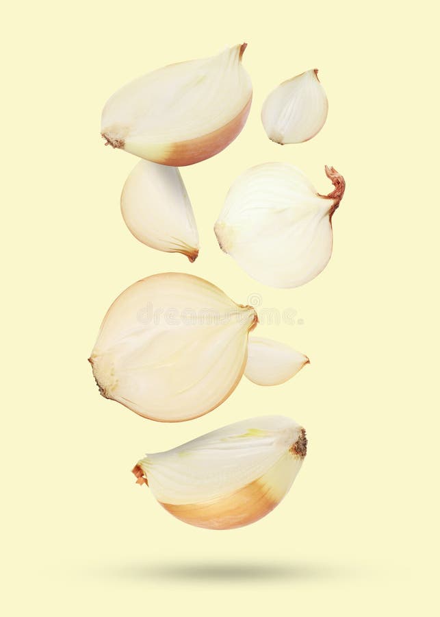 Cut Fresh Onions Falling on Beige Background Stock Image - Image of ...