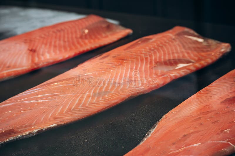 Cut Fresh Salmon in a Fishmonger S Display Case Stock Photo - Image of ...