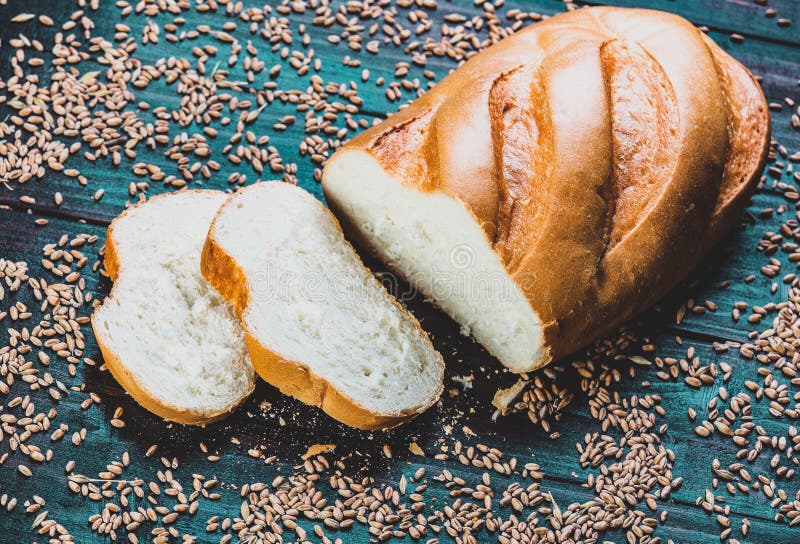 Cut Fresh Wheat Bread with Grains Around Stock Photo - Image of loaf ...