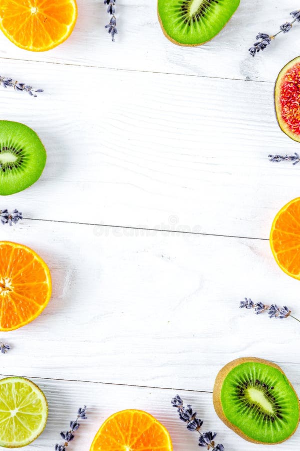Cut Fruit Frame Design with Lavender on White Background Top View ...