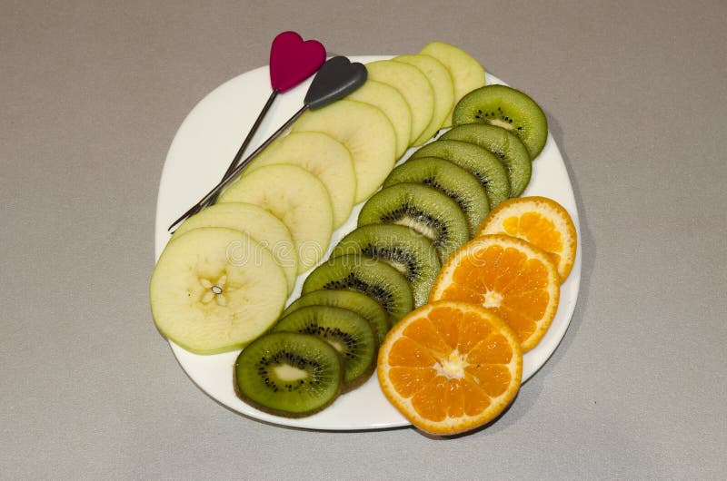The Cut Fruit on a Plate Apple Orange Cutting by Segments Stock Image ...