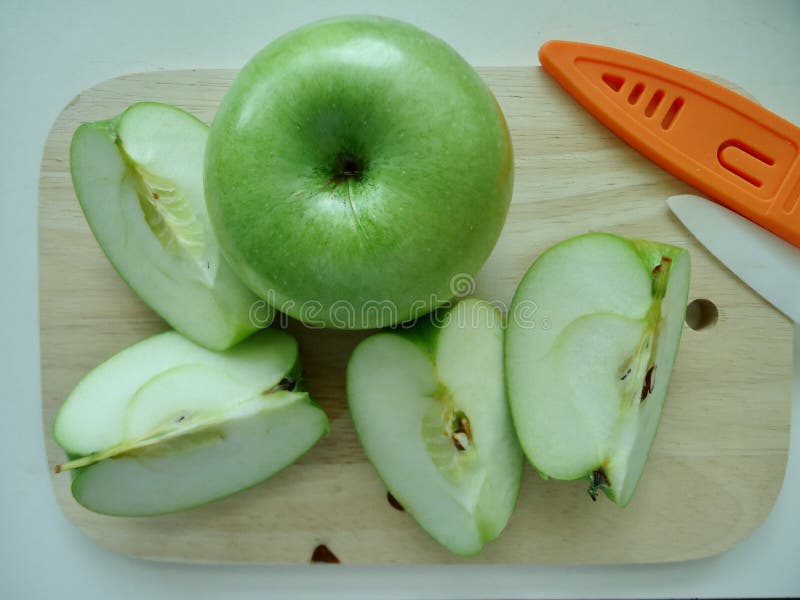 Cut green apple stock photo. Image of gourmet, edible - 97996186