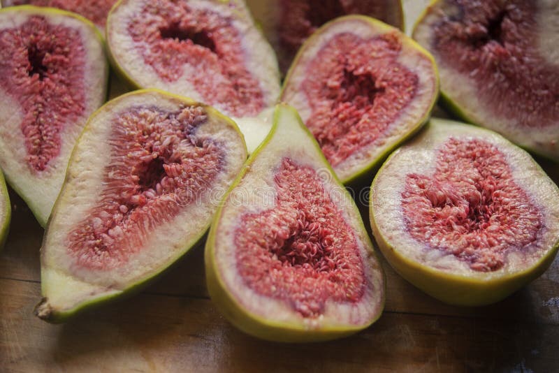 Cut Green Figs with a Pink Heart on a Light Board, Close-up Stock Image ...