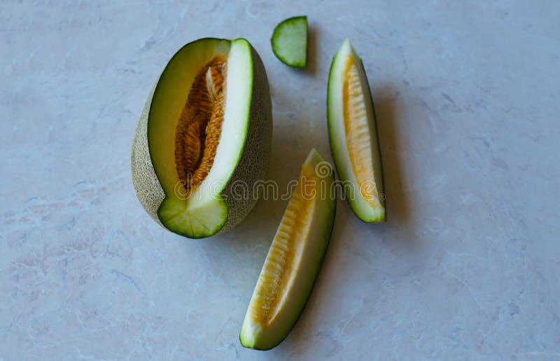 Cut the green melon stock image. Image of cantaloupe - 318951493