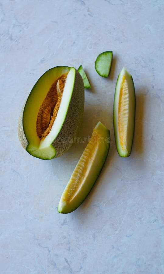 Cut the green melon stock photo. Image of delicious - 318951742