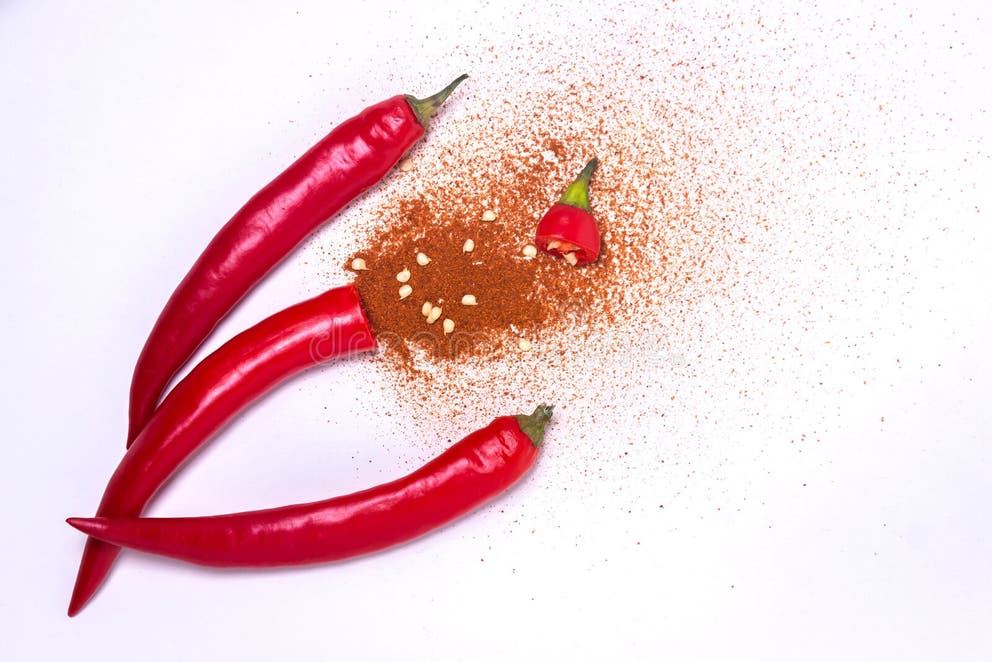 Cut in Half Red Chili Peppers with Ground Red Chili Peppers Stock Photo ...