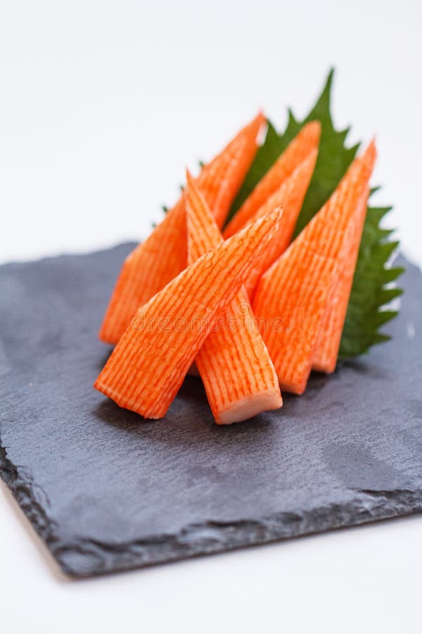 Cut Kani Crab Stick Sashimi Served with Sliced Radish on Stone Plate ...