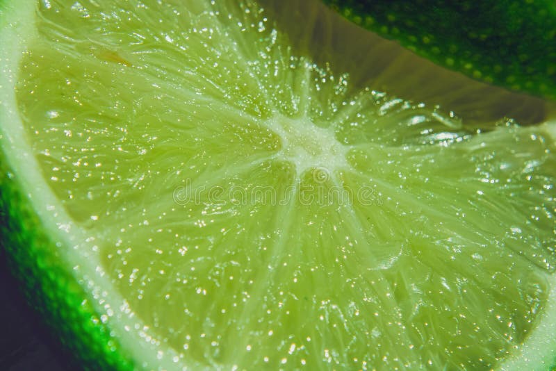 A cut lime close-up stock photo. Image of food, vibrant - 253768448