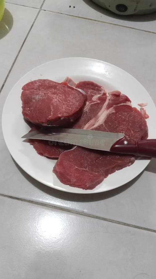 Cut the Meat in a Plate with New Knife Stock Photo - Image of meat ...
