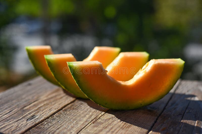 Cut melon segments stock photo. Image of vegetable, table - 59931372