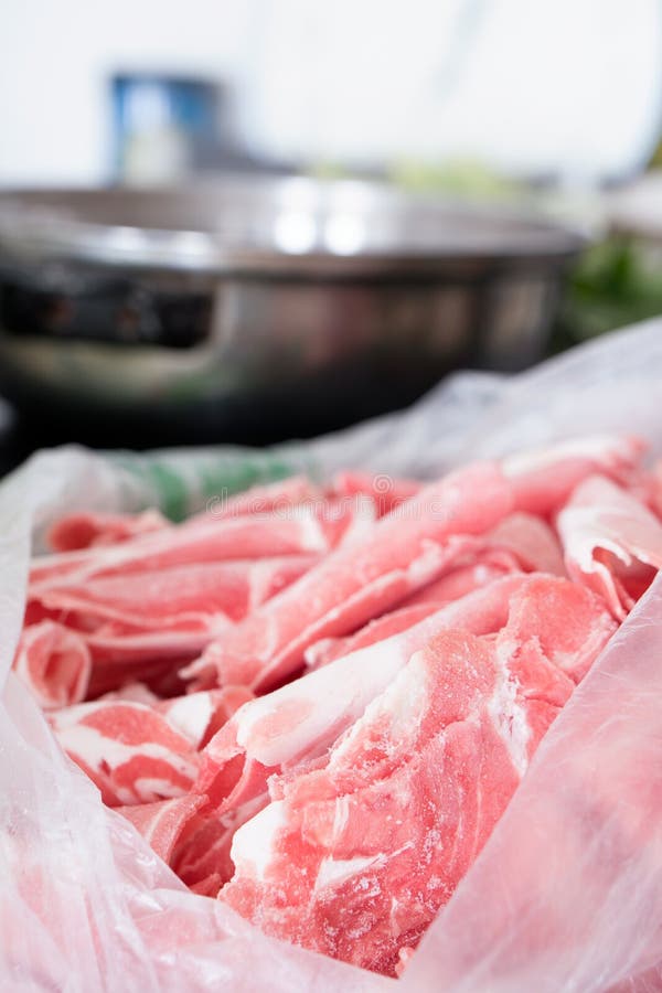The Cut Mutton Roll and the Hot Pot on the Induction Cooker Stock Photo ...