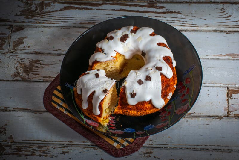 A Cut-off Piece of Cake on a Dark Plate Stock Photo - Image of bake ...