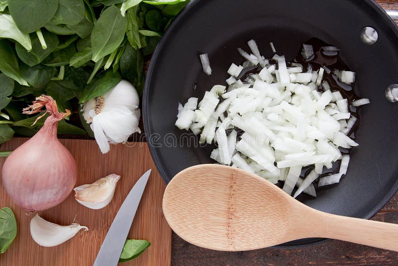 Cut onion in a frying pan stock image. Image of sliced - 55241447