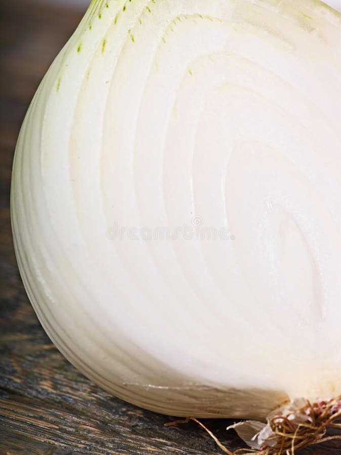 Cut onion on wooden back stock image. Image of group - 49431373