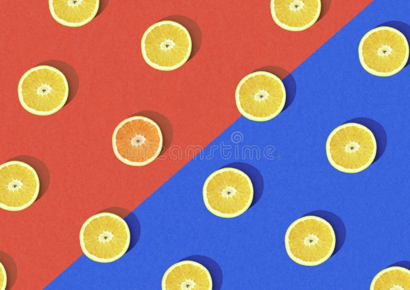 Cut Orange and Lemon Pieces on Red Blue Split Background Stock ...