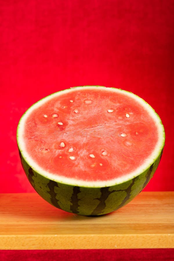 A Cut Out Fresh Watermelon on Red at Vertical Composition Stock Photo ...