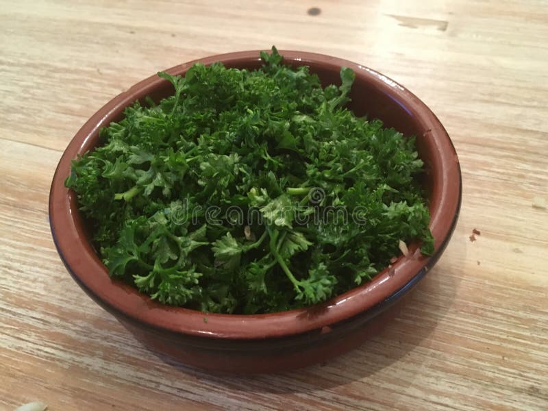 Cut parsley in a bowl stock image. Image of grey, simmering - 87277933