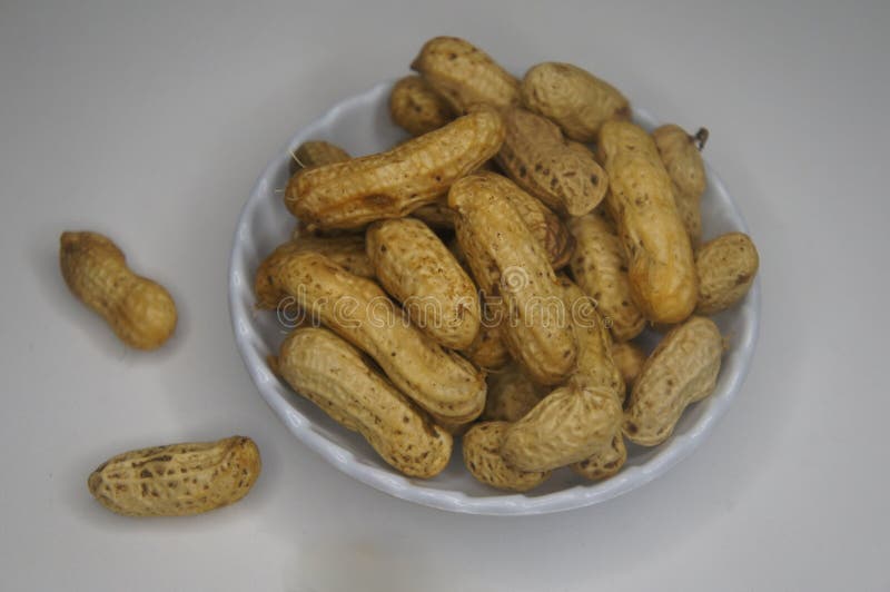 Cut peanut seeds isolated stock photo. Image of fruit - 337754698