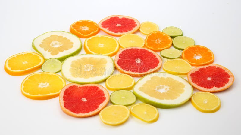 Cut Pieces Of Different Citrus Fruits On White Background Stock Photo ...