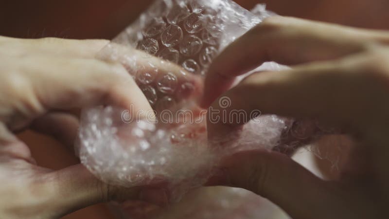 Cut a Plastic Bubble Wrap Packaging with Scissors Stock Video - Video ...