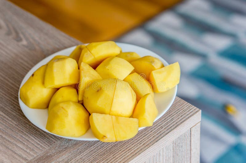 Cut potatoes on plate stock image. Image of potatoes - 85988529