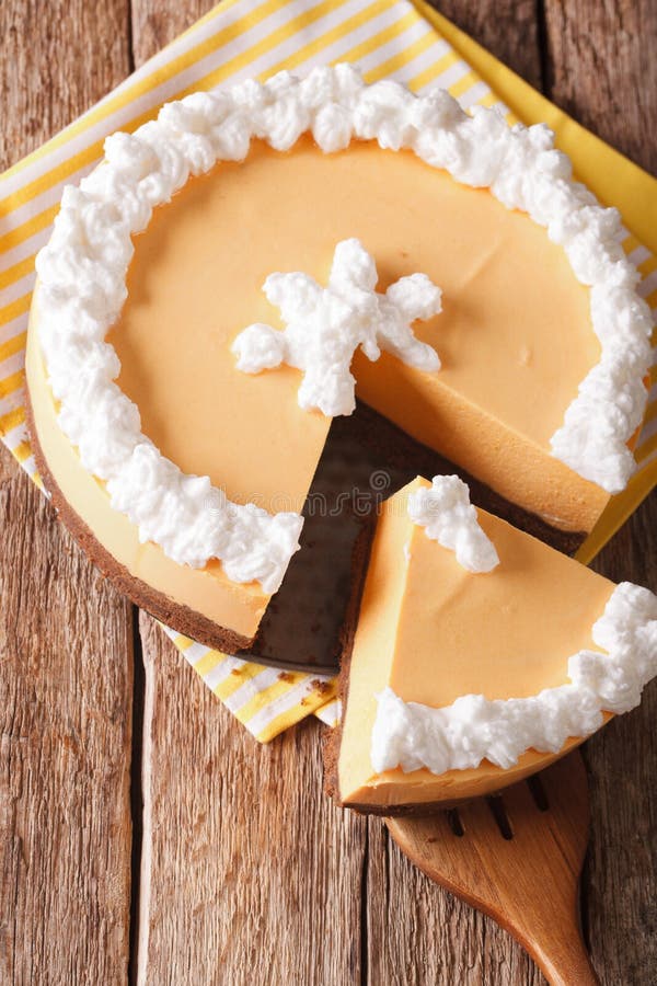 Cut Pumpkin Cheesecake Close-up on the Table. Vertical Top View Stock ...