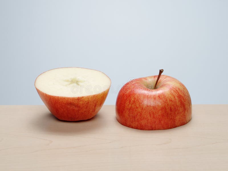 Ripe Red Apple Cut in Half with Top Floating Above Bottom Stock Photo ...