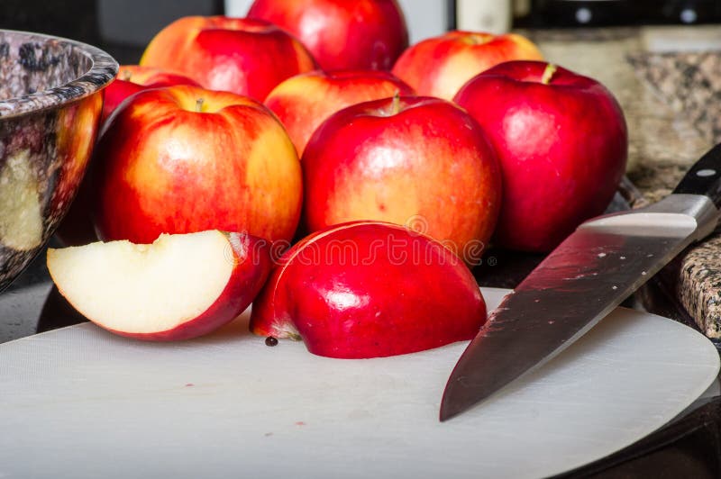 Cut red apples with knife stock photo. Image of baking - 54768262