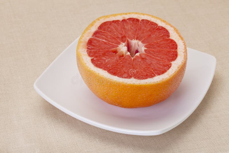Cut red grapefruit stock image. Image of tablecloth, juicy - 18461647