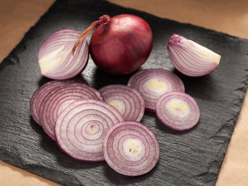 Cut Red Onion on a Chopping Board Stock Image - Image of group, food ...