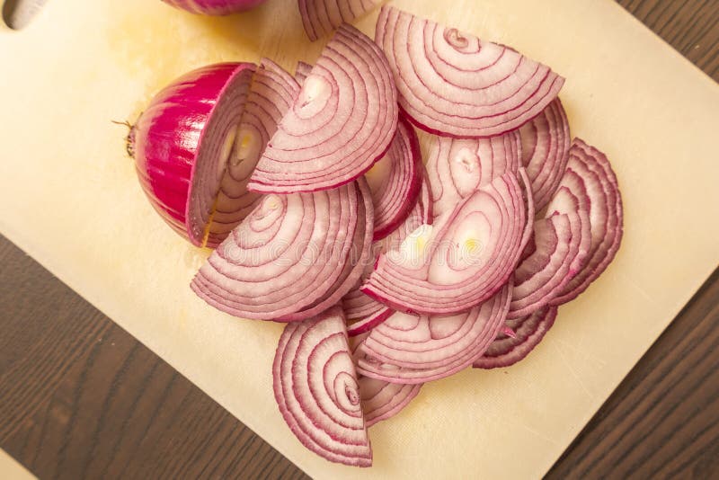 Cut Red Onion on a White Board Stock Photo - Image of kitchen ...
