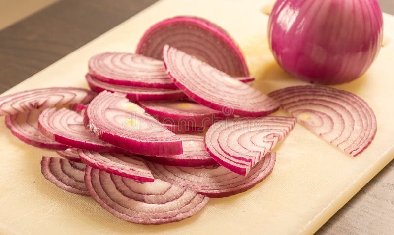 Cut Red Onion on a White Board Stock Photo - Image of nutrition ...