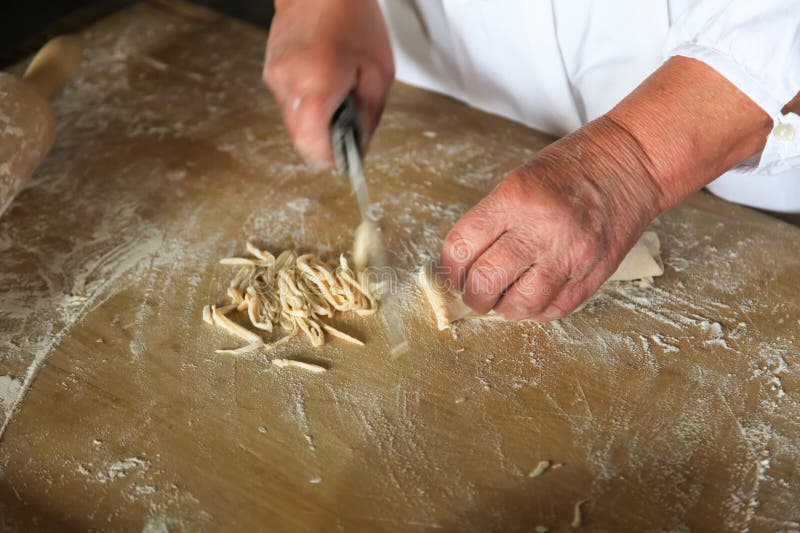 Cut Rolled Dough into Noodles Stock Photo - Image of ingredient, chef ...