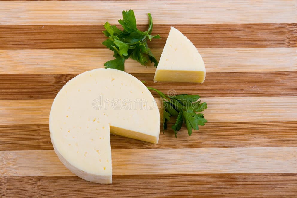 Cut round cheese stock photo. Image of brown, cutting - 21592704
