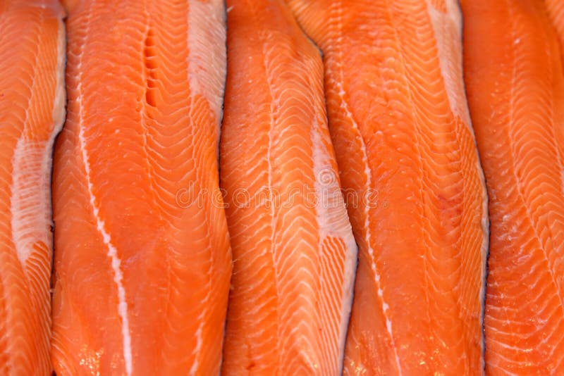 Cut Slices of Red Fish Fillet with Pepper on the Counter Stock Photo ...