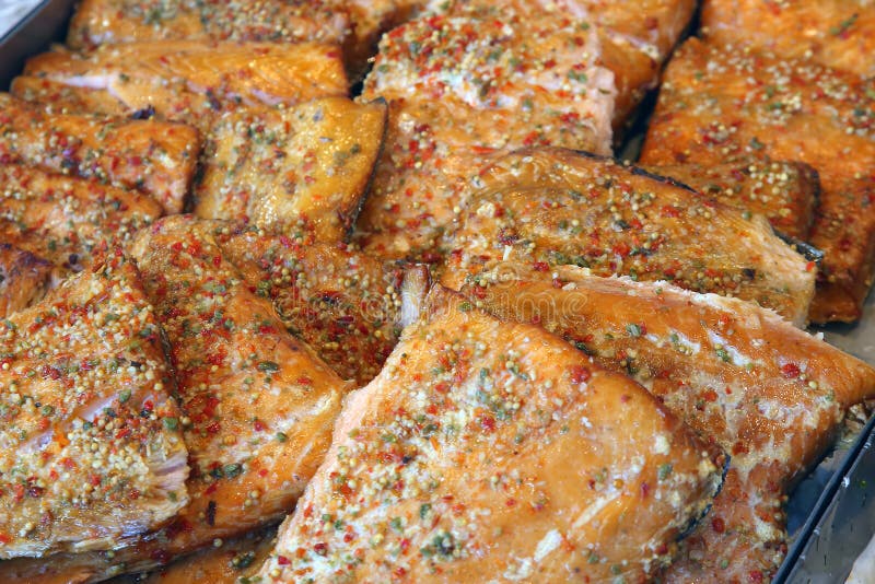 Cut Slices of Red Fish Fillet with Pepper on the Counter Stock Photo ...
