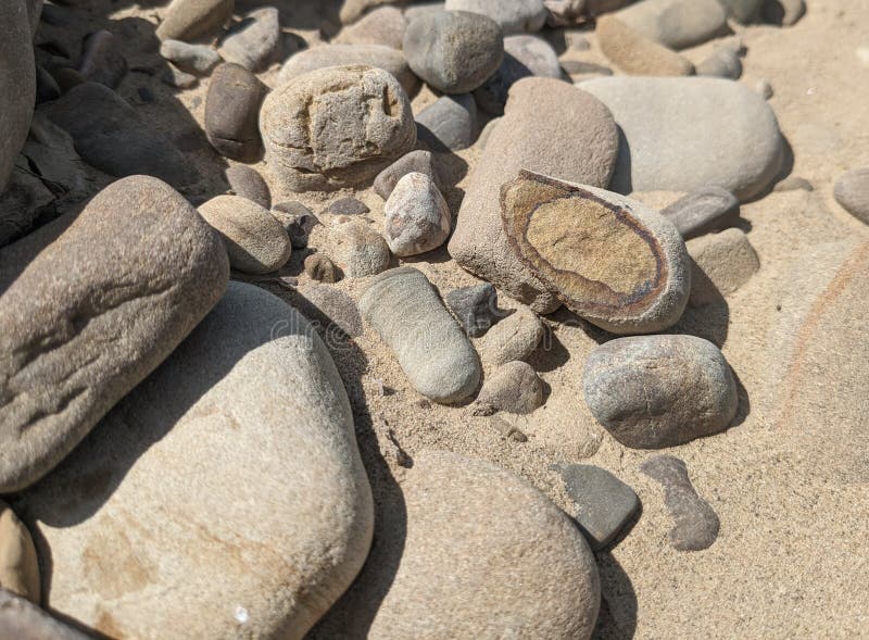 A Cut of Stone, Pebbles with Different Layers of Minerals. Stock Photo ...